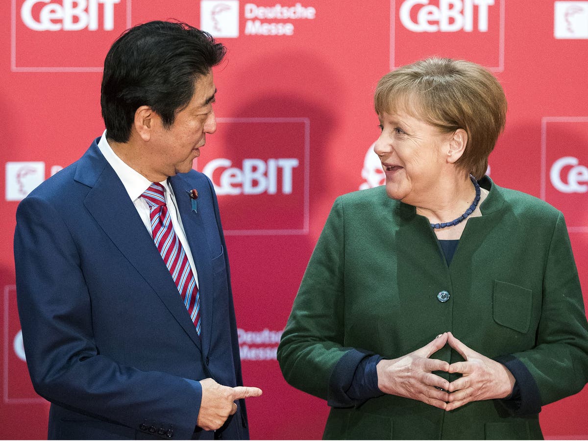 Angela Merkel and Japan's Shinzo Abe make subtle digs at Donald Trump ...