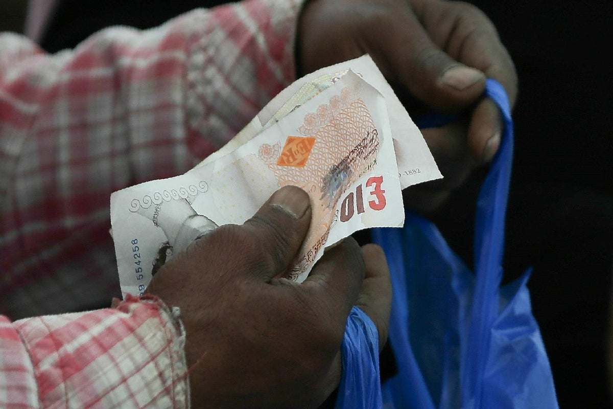 UK households are spending less as they face biggest budget squeeze in ...