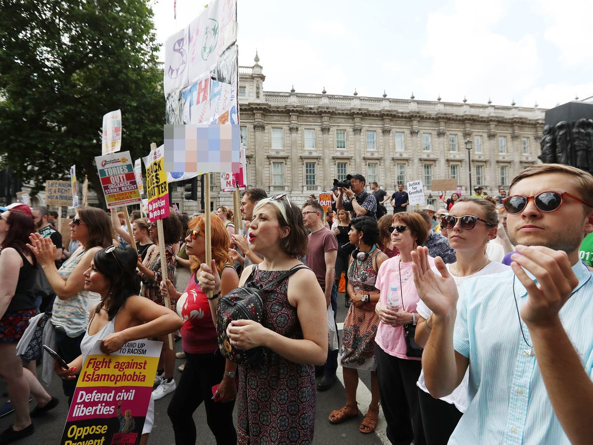 Protest at Downing Street over Theresa May's DUP deal and Grenfell ...