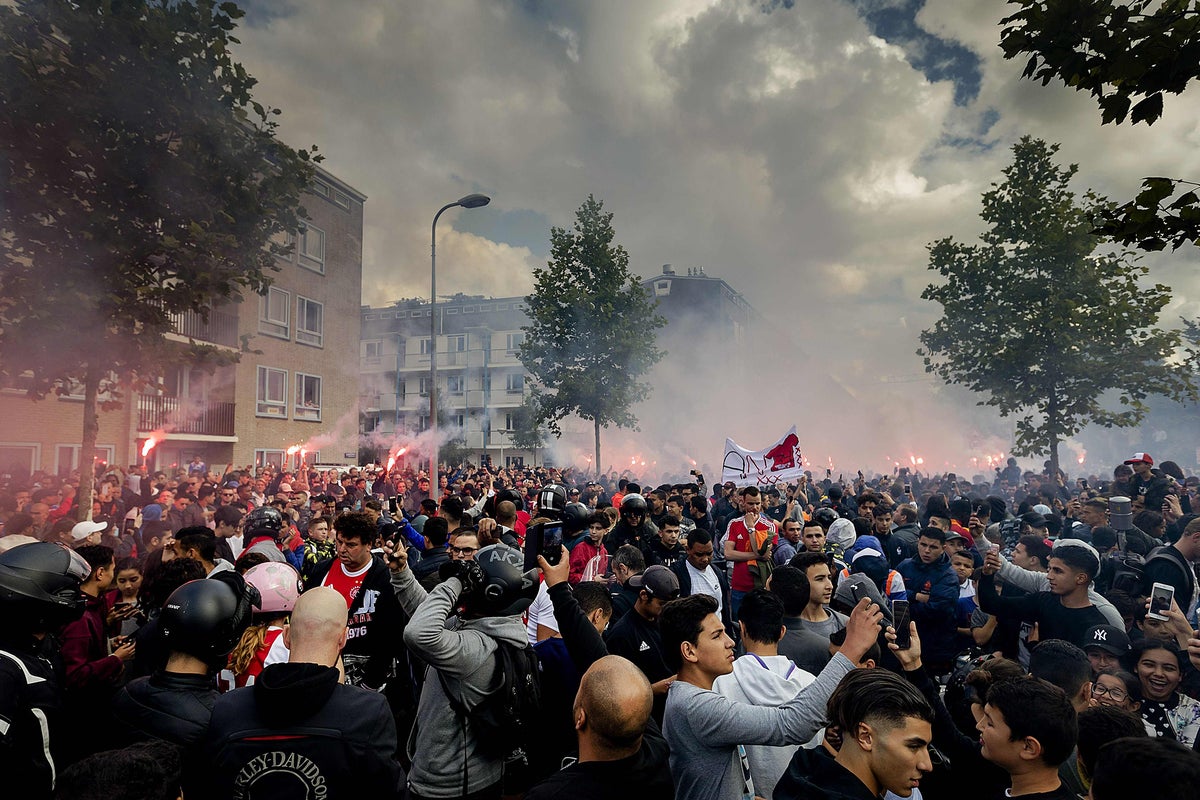 Ajax fans rally outside home of football player who suffered brain ...