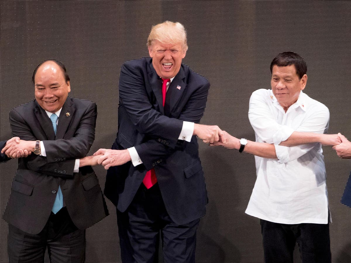 Donald Trump baffled by group handshake with fellow leaders at ASEAN ...