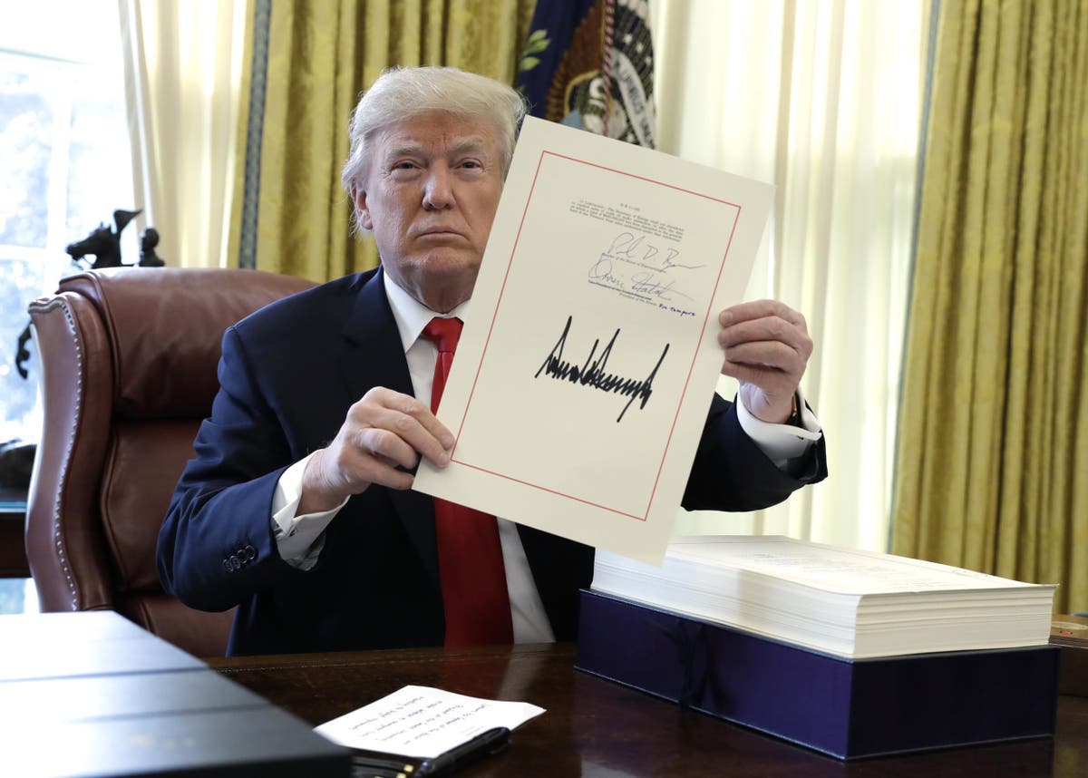Donald Trump signs $1.5 trillion tax bill into law | The Independent ...