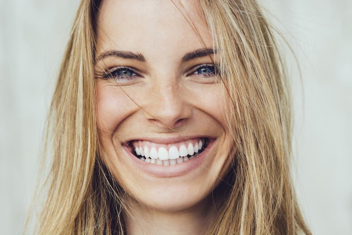 Smiling in passport photos could help prevent identity fraud, study ...