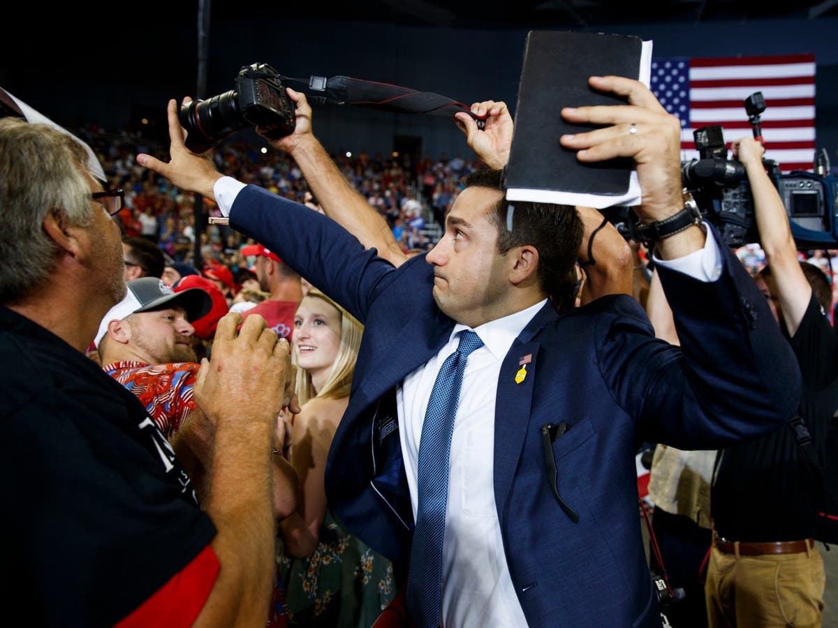 Trump Indiana rally: Volunteer tries to block news photographer from ...