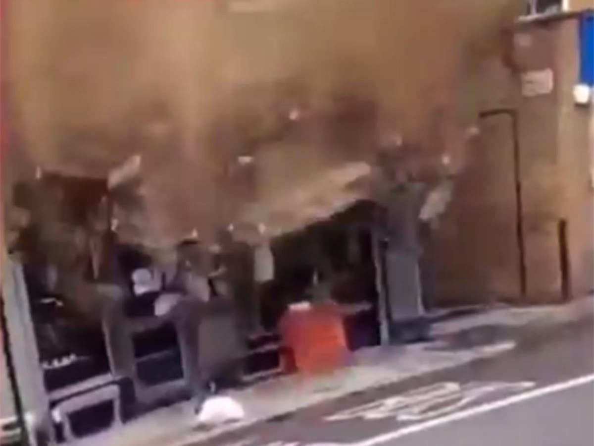 Café roof filmed collapsing seconds after man walked past it | The ...
