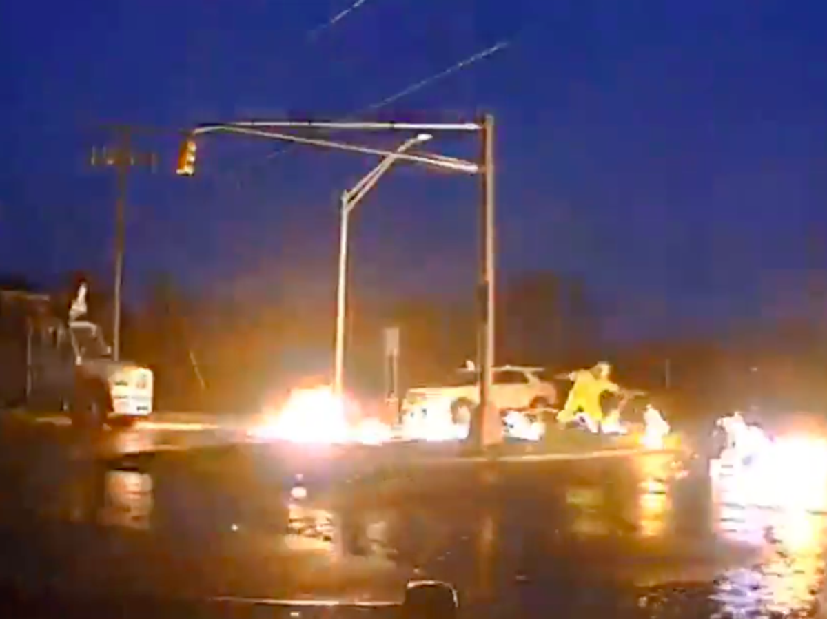 Utility worker narrowly avoids death as electric cable wire catches ...