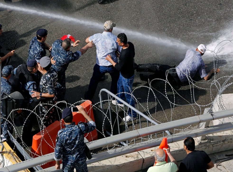 Lebanon security forces blast anti-austerity protestors with water ...