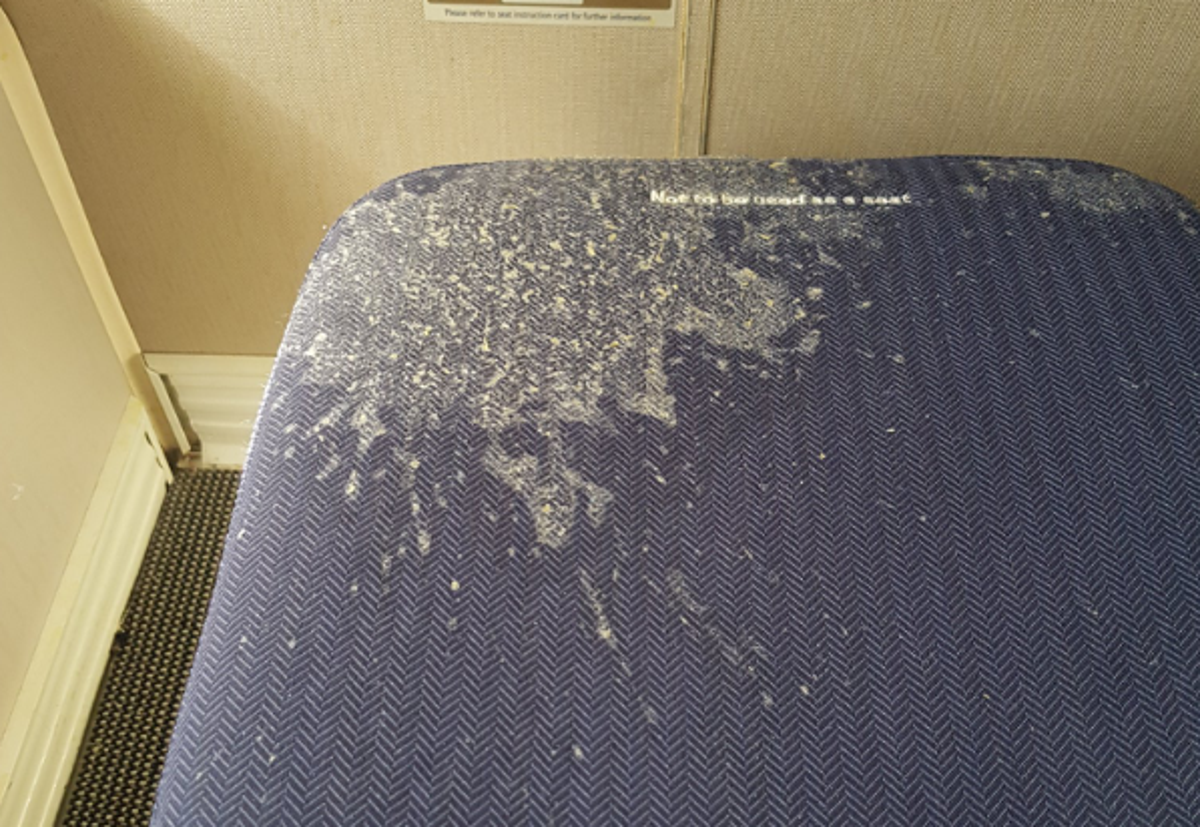 British Airways business class passenger forced to sit surrounded by ...