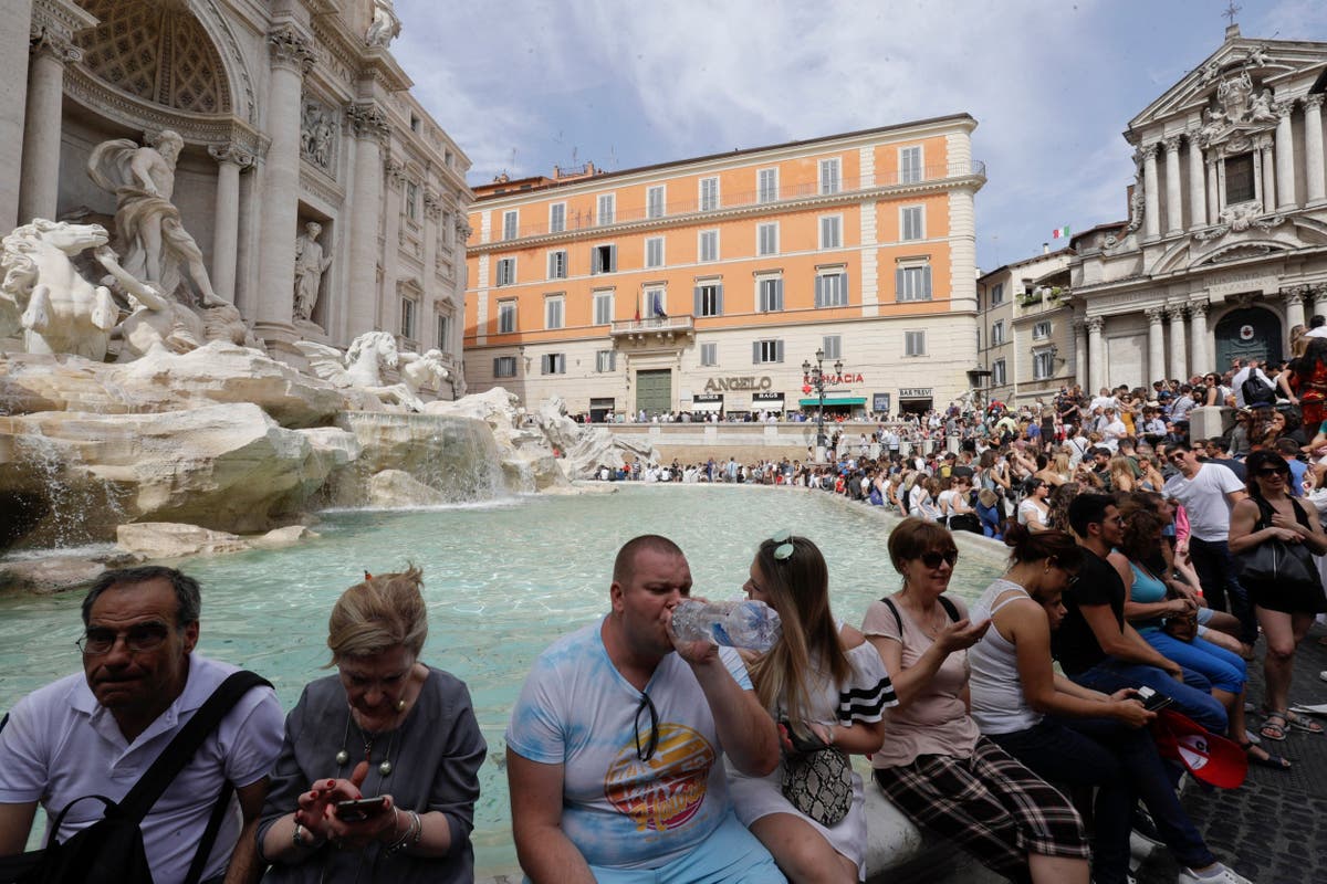 Rome bans tourists from going topless, eating 'messy' food and leaving ...