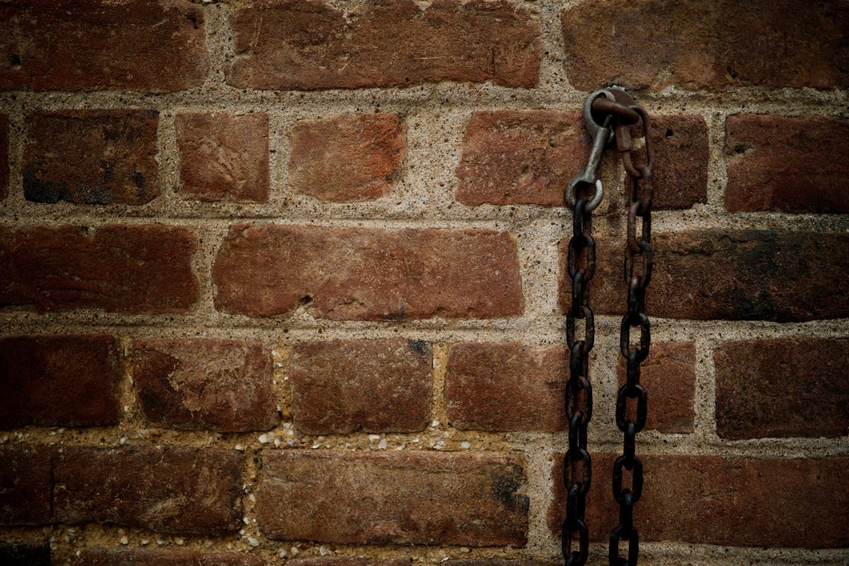 Slave Chained To Wall
