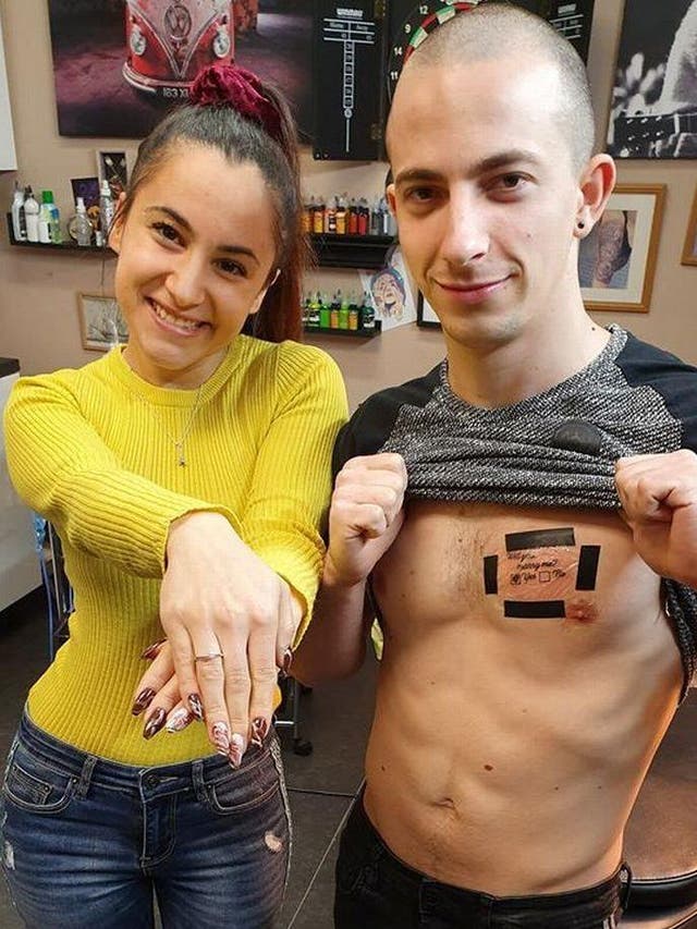 Man proposes to girlfriend with tattoo featuring 'Yes' or 'No' boxes ...