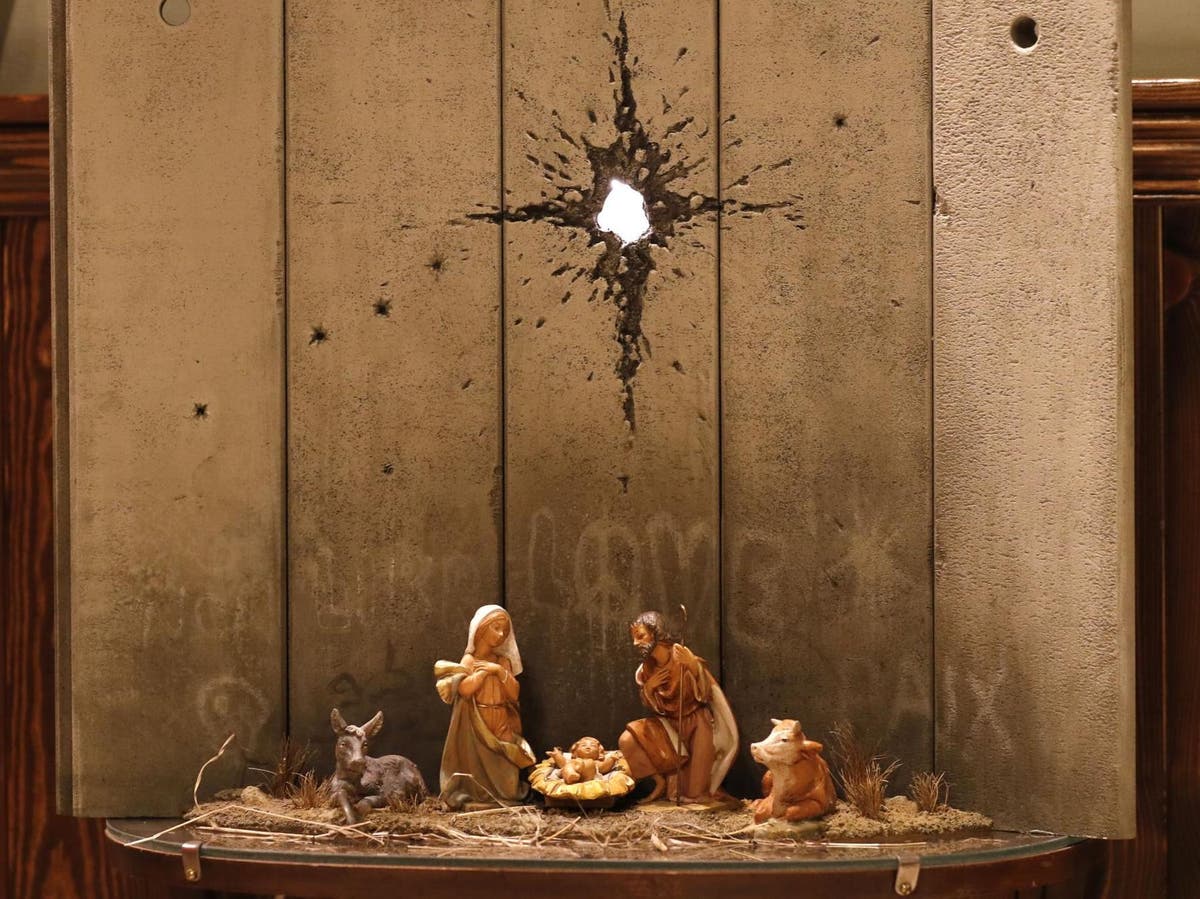 Banksy: Mysterious street artist's 'modified nativity scene' appears in ...