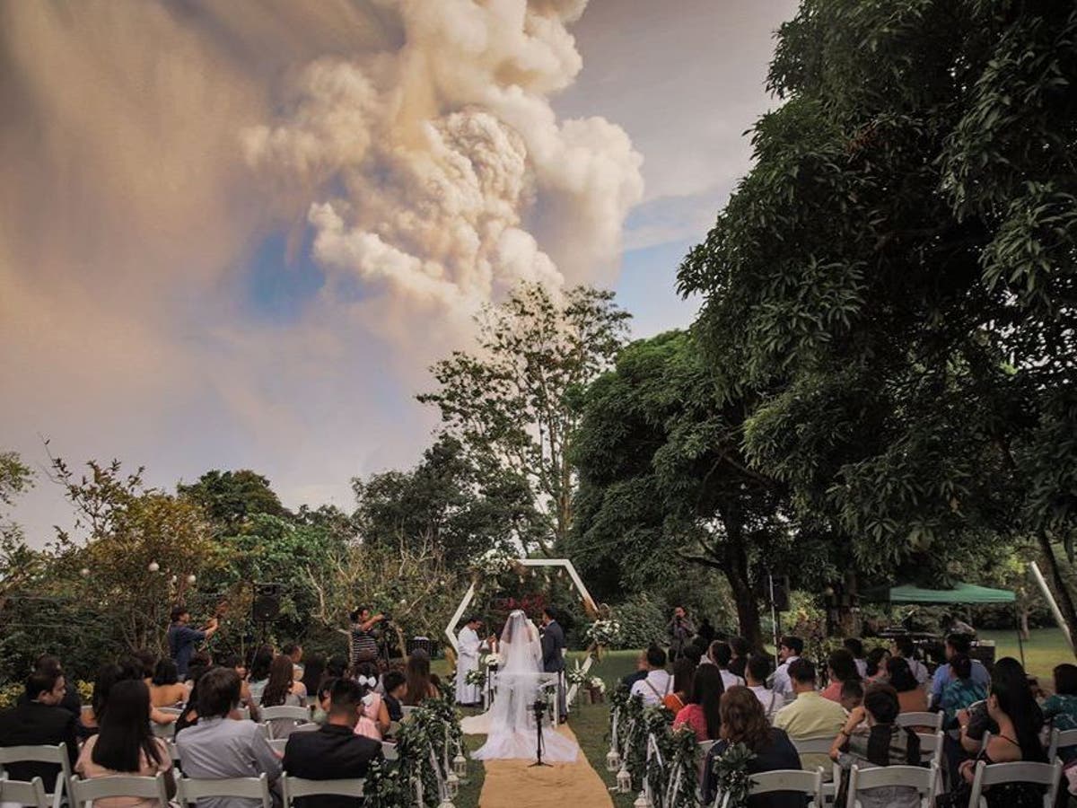 Couple marry in the Philippines as Taal volcano erupts behind them ...