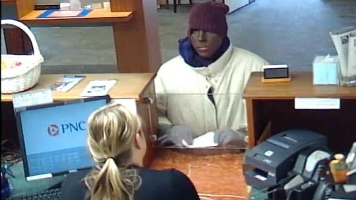 Manhunt for bank robber who used blackface to disguise himself | The ...