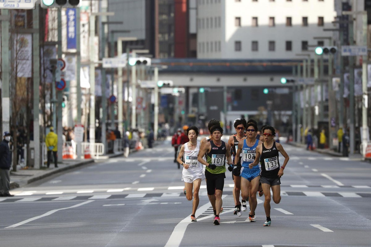 Coronavirus: Empty streets greet runners in Tokyo marathon as ...
