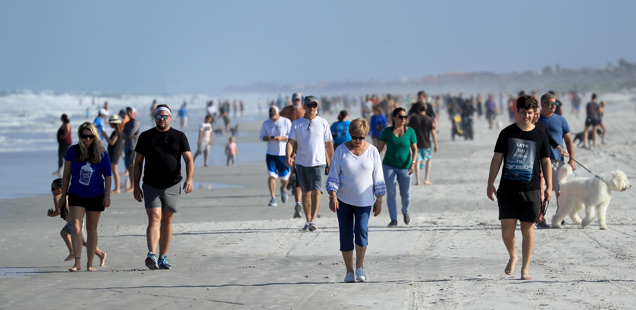 Coronavirus: Florida beach swamped by huge crowds as Ron DeSantis ...