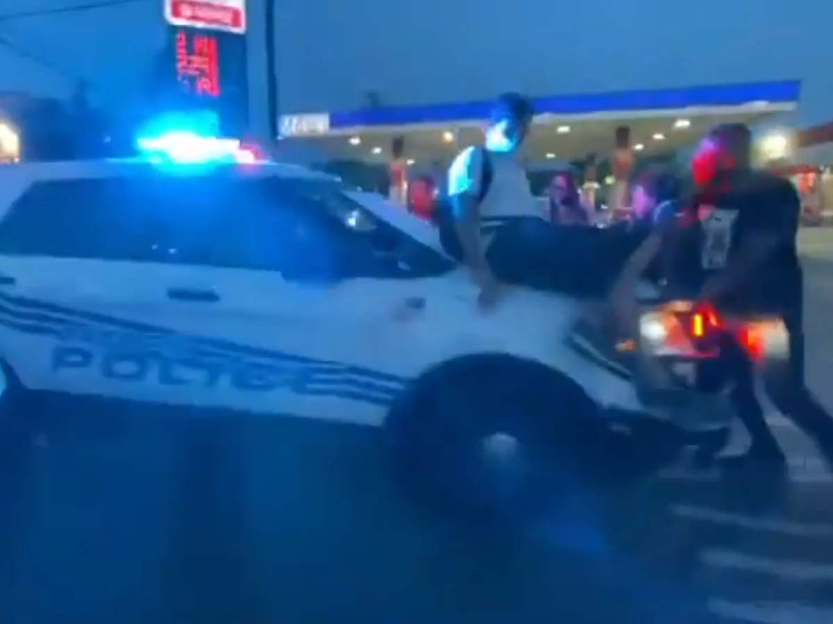 Two police cars drive into crowd of protesters in Detroit | The ...